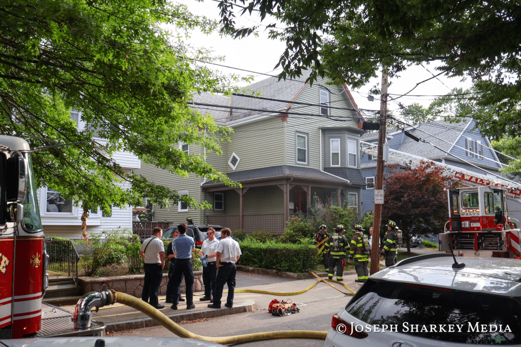Firefighters extinguish a small house fire on Washington Avenue ...